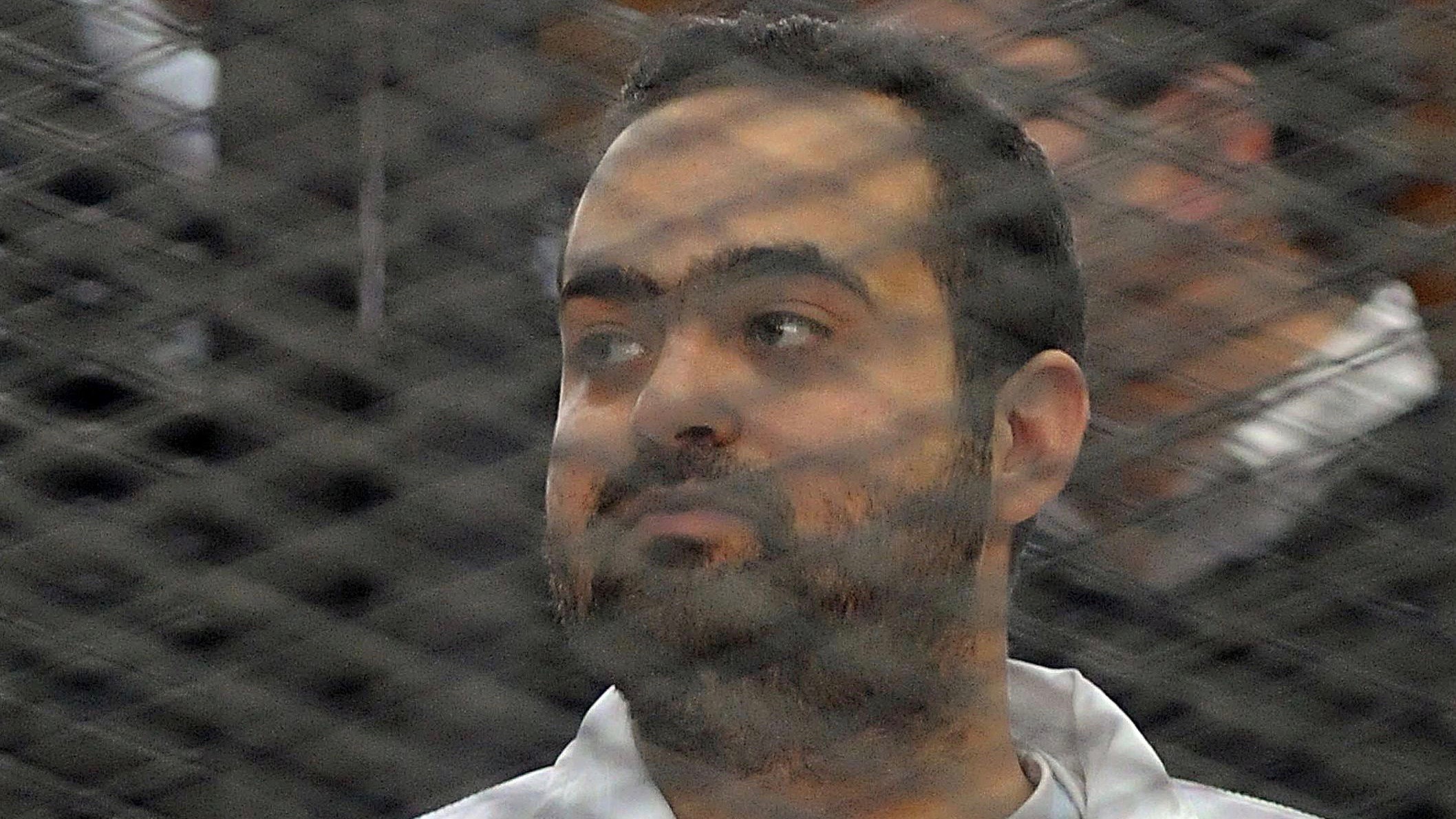 Egyptian prominent activicts Mohamed Adel stands in the accused dock ... Egyptian prominent activicts Mohamed Adel stands in the accused dock ...